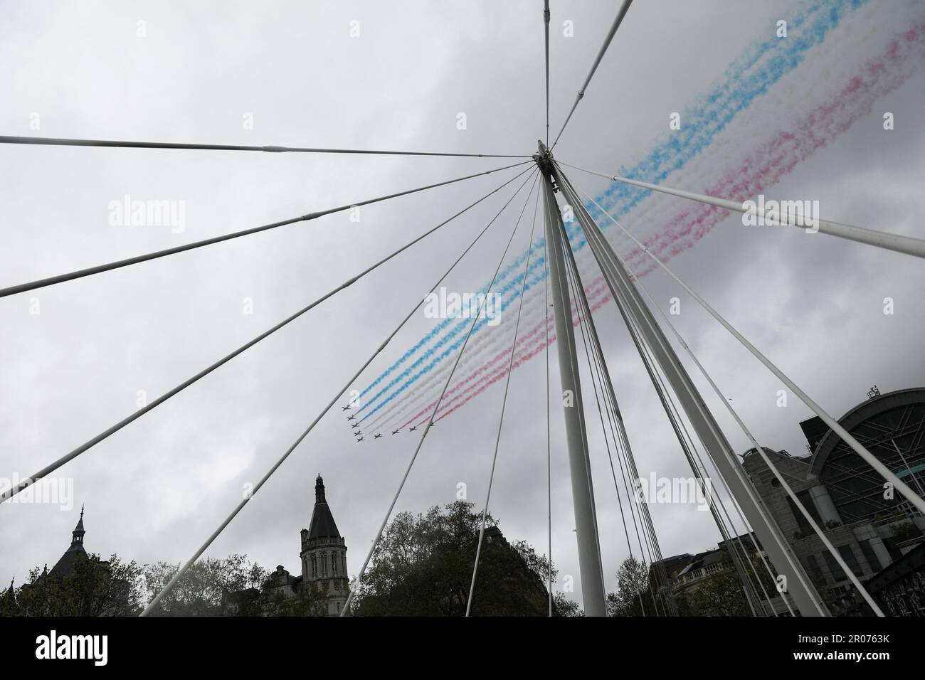 A general view of a flypast by aircraft from the Red Arrows over London ...
