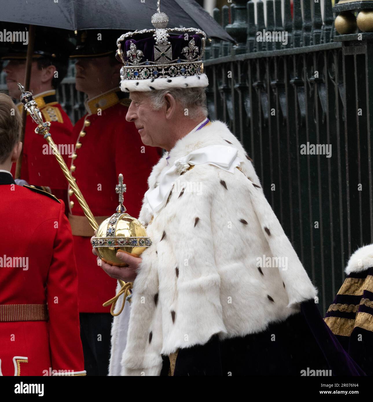 King Charles III, wearing the Imperial State Crown, leaves Westminster ...
