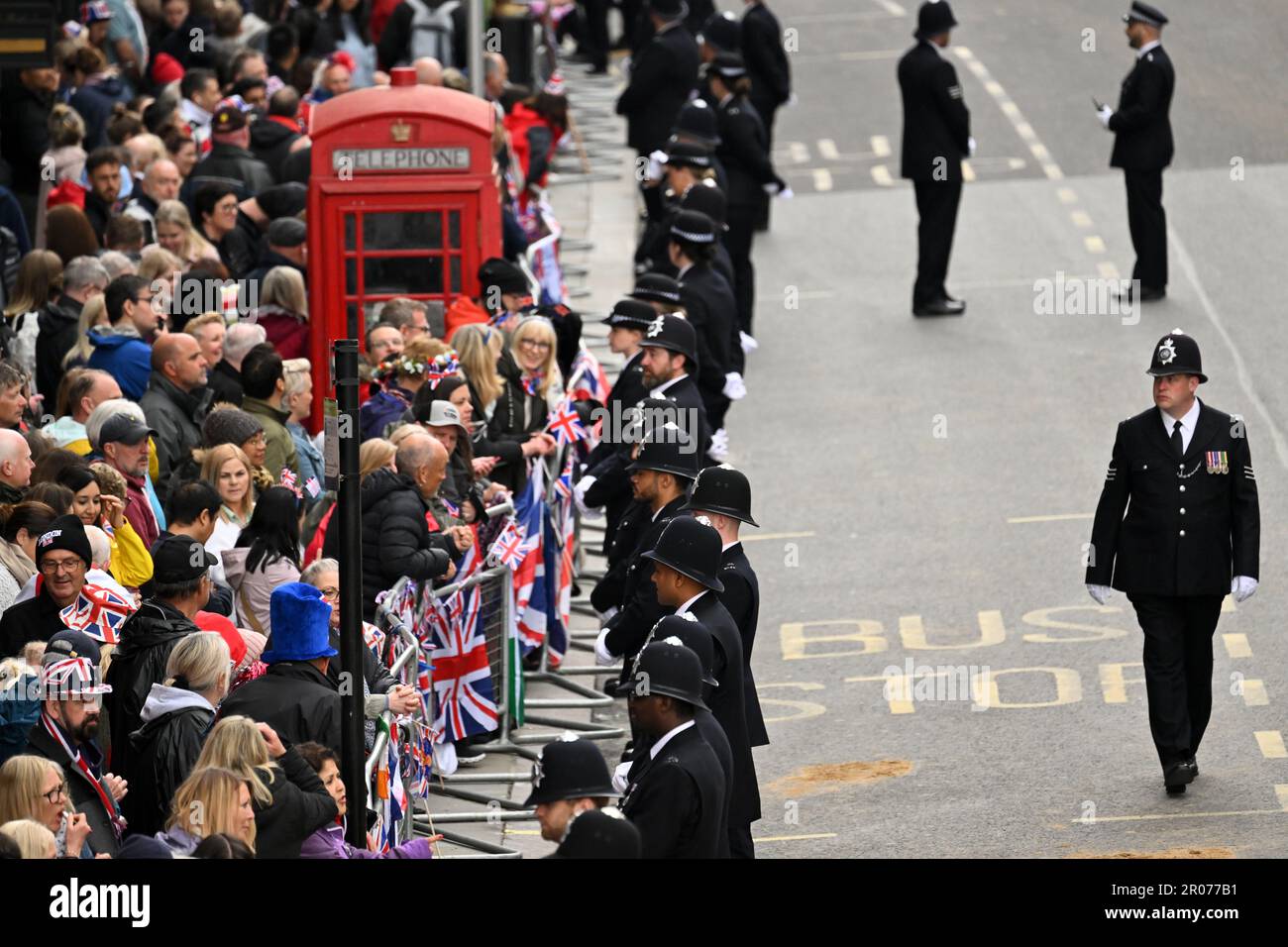 Police officers and well wishers line the route from Buckingham Palace ...
