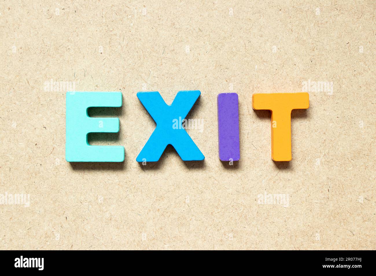 Color alphabet letter in word exit on wood background Stock Photo - Alamy