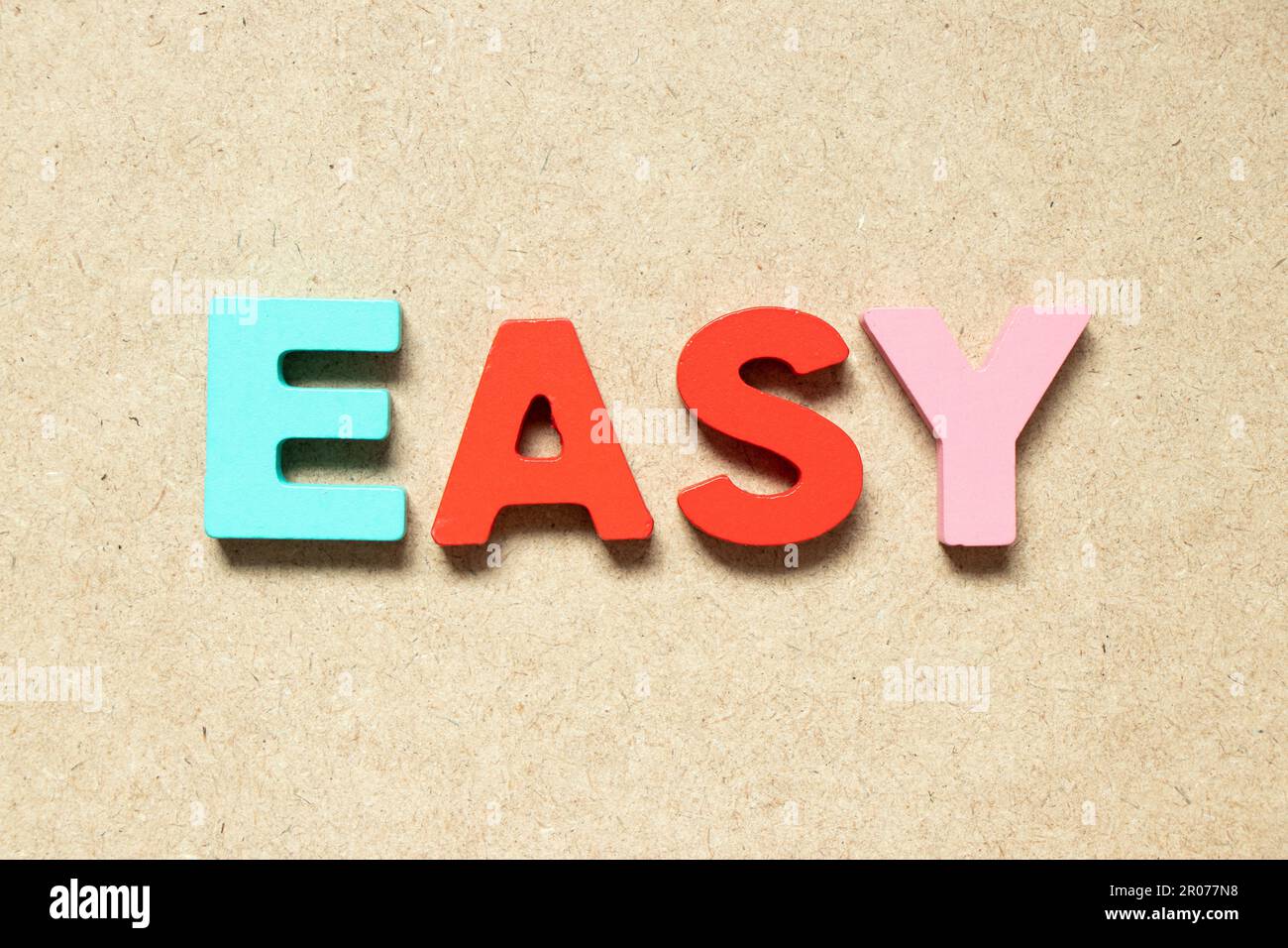 Color alphabet letter in word easy on wood background Stock Photo - Alamy