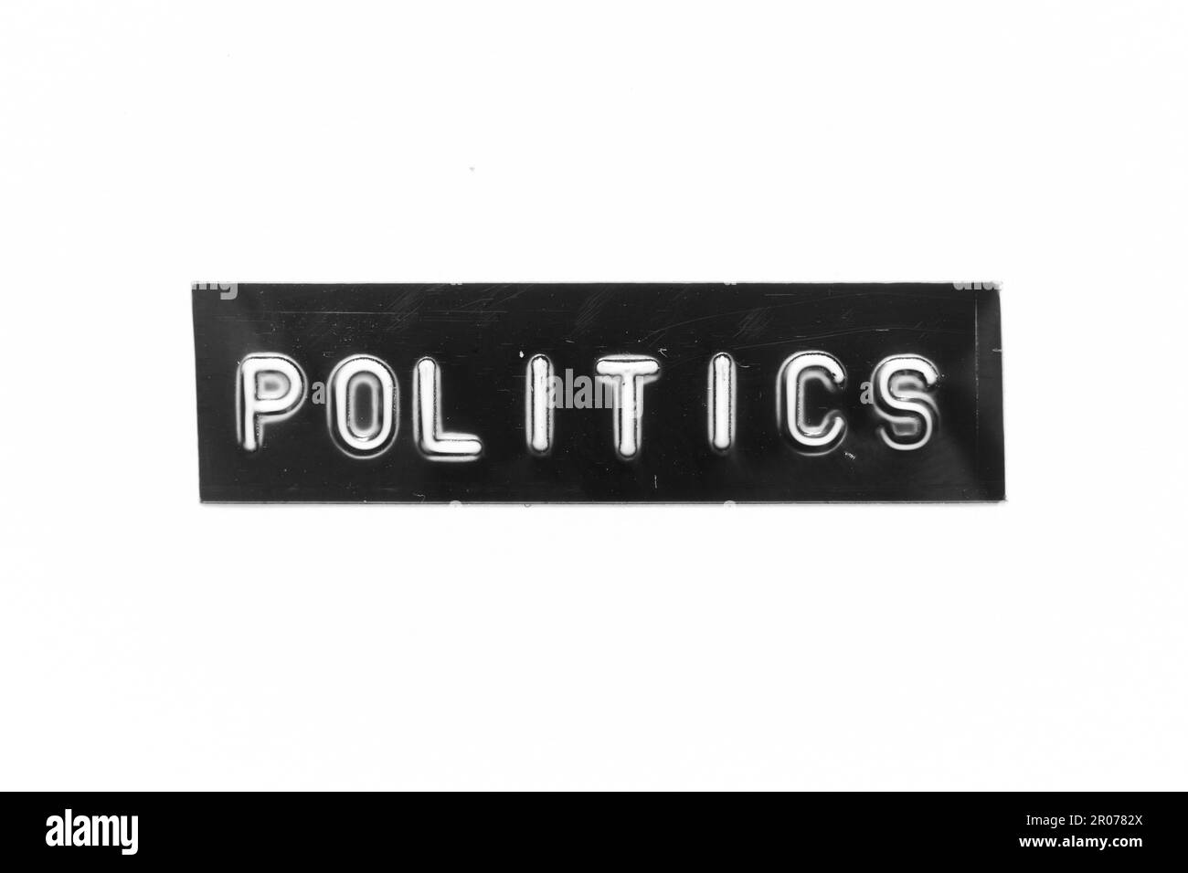 Black color banner that have embossed letter with word politics on ...