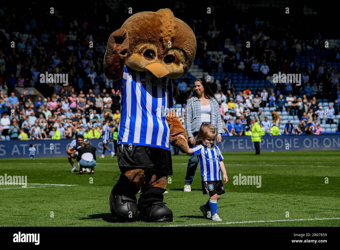 Mascot and child waves at the fans on the lap of honour during the Sky ...