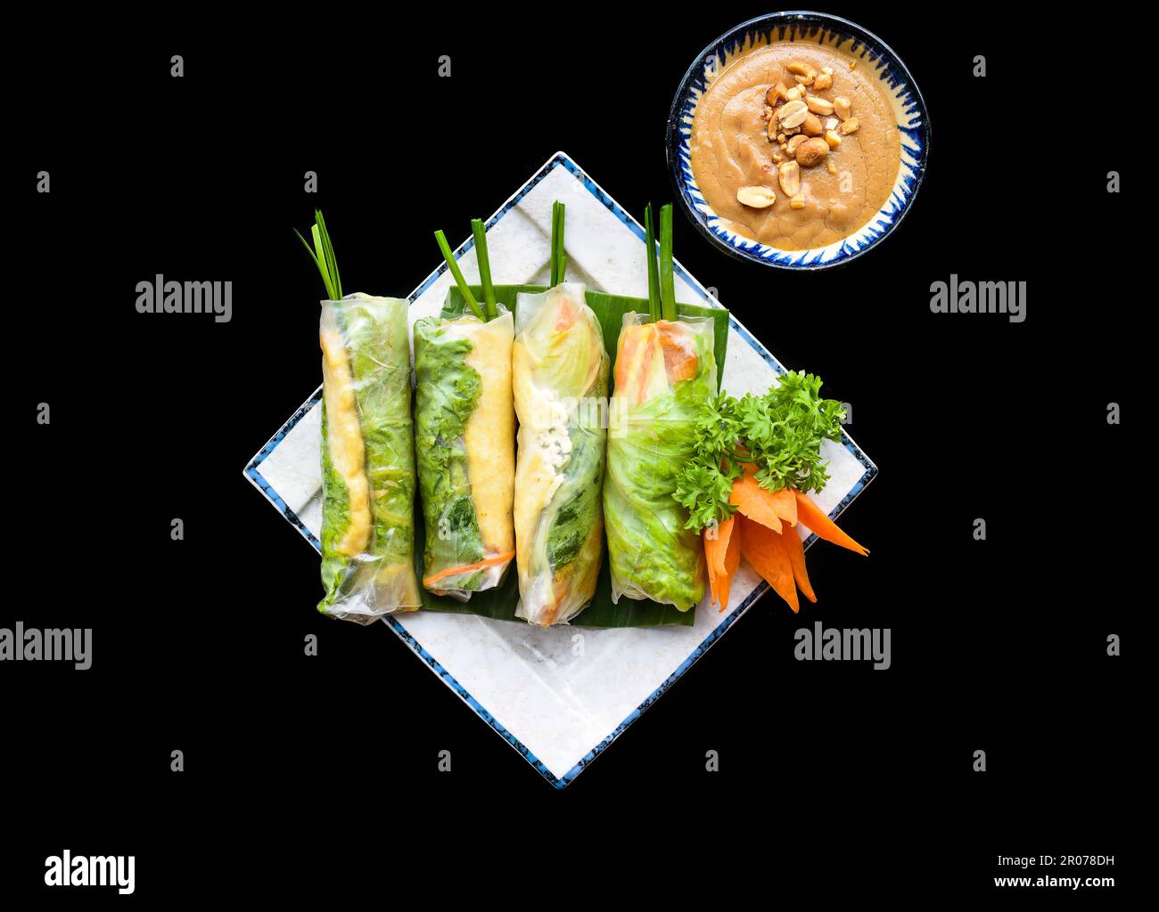 Vietnamese nem spring rolls in leaf with sauce Stock Photo - Alamy