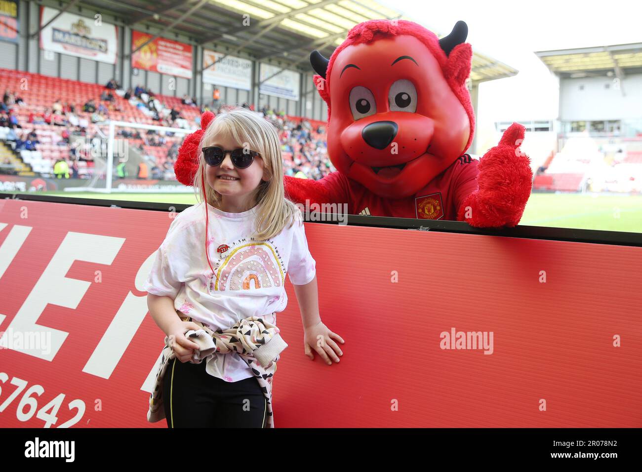 A young Manchester United fan poses with Fred the Red before the ...
