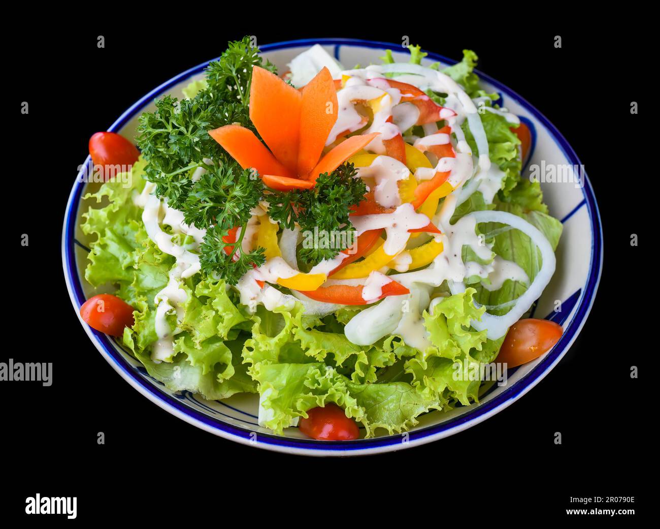 Fresh Vietnamese salad with vegetables on black background side view ...