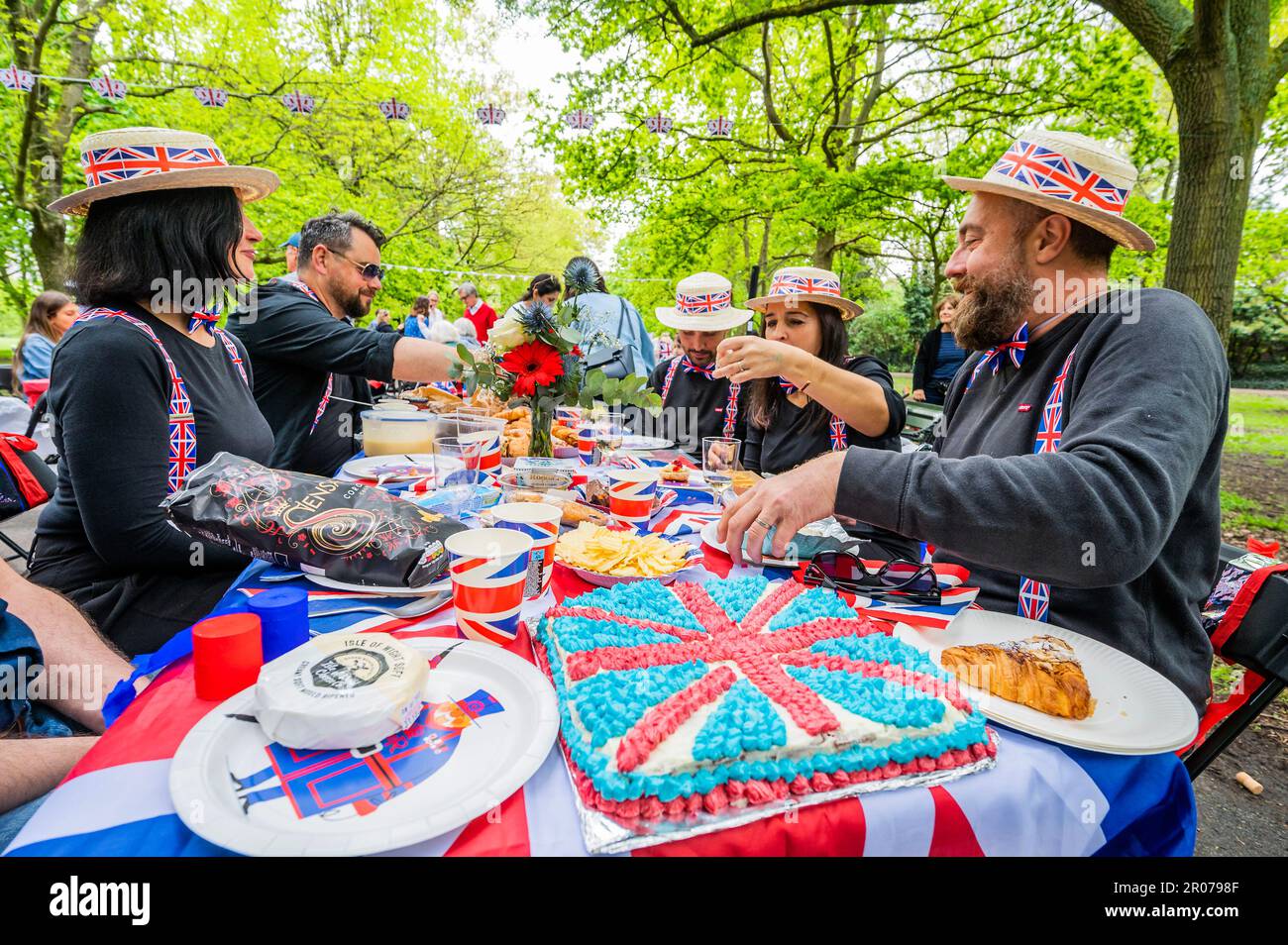 London, UK. 7th May, 2023. A group of londoners bring a german friend ...