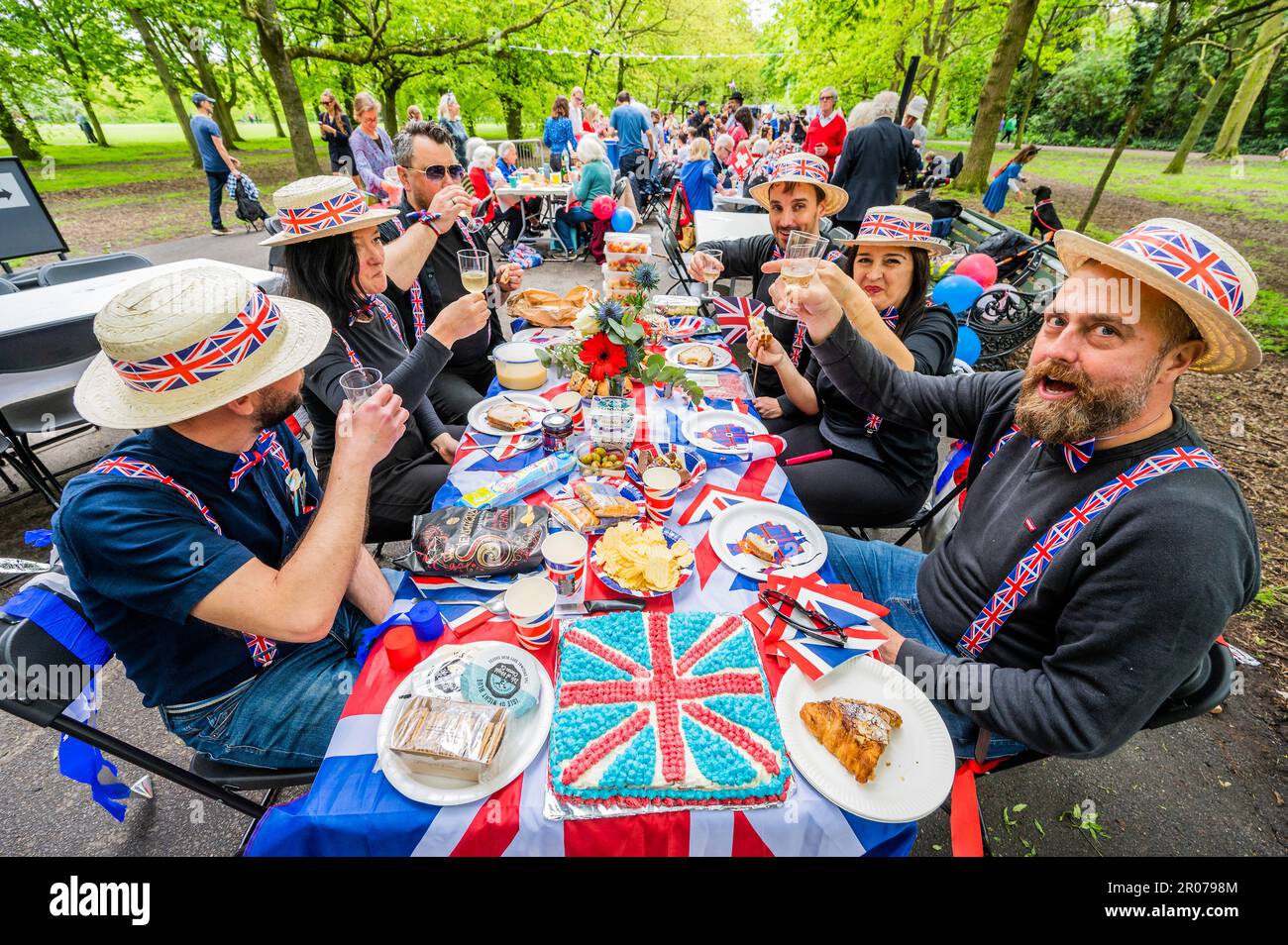 London, UK. 7th May, 2023. A group of londoners bring a german friend ...