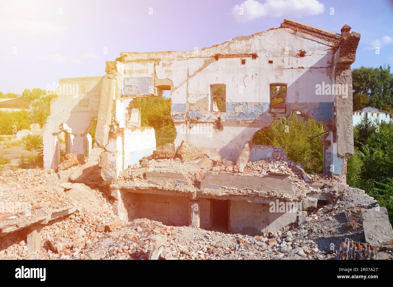 Collapsed industrial multistorey building in daytime. Disaster scene ...