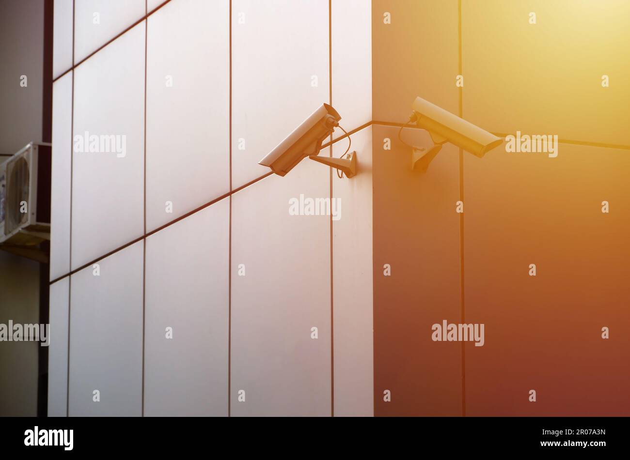 Modern CCTV cameras on a silver plastic wall. Concept of surveillance ...