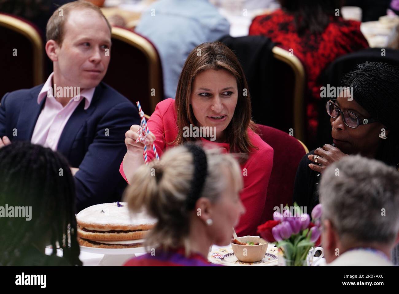 Lucy Fraser speaks to guest during a Coronation Big Lunch in Downing ...