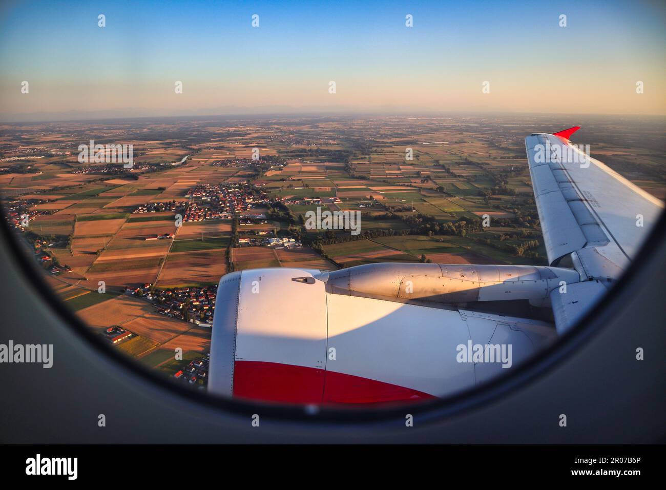 An aerial view of an airplane in flight over a rural landscape Stock ...