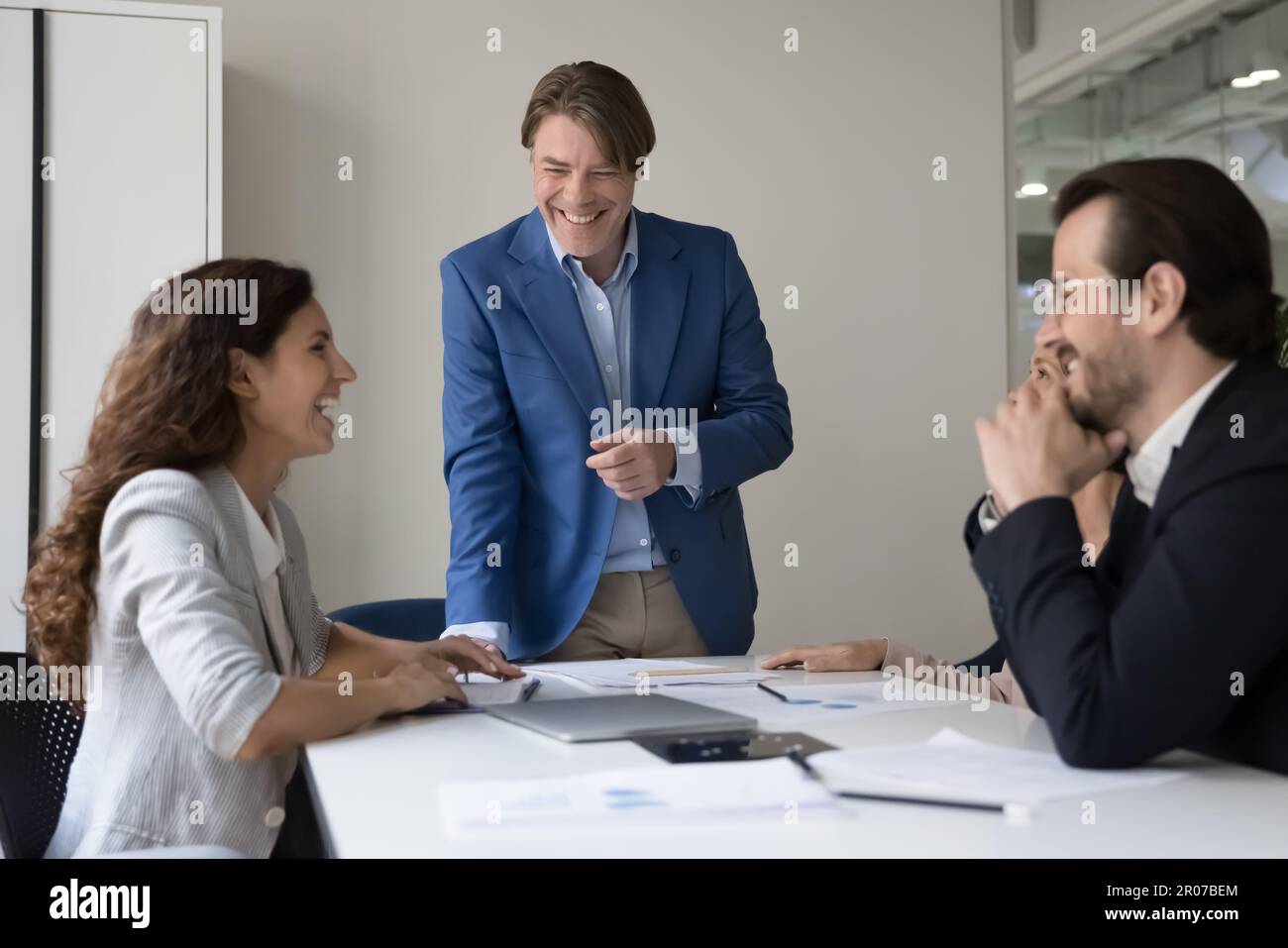 Group of business team enjoy funny work moment discus report Stock ...