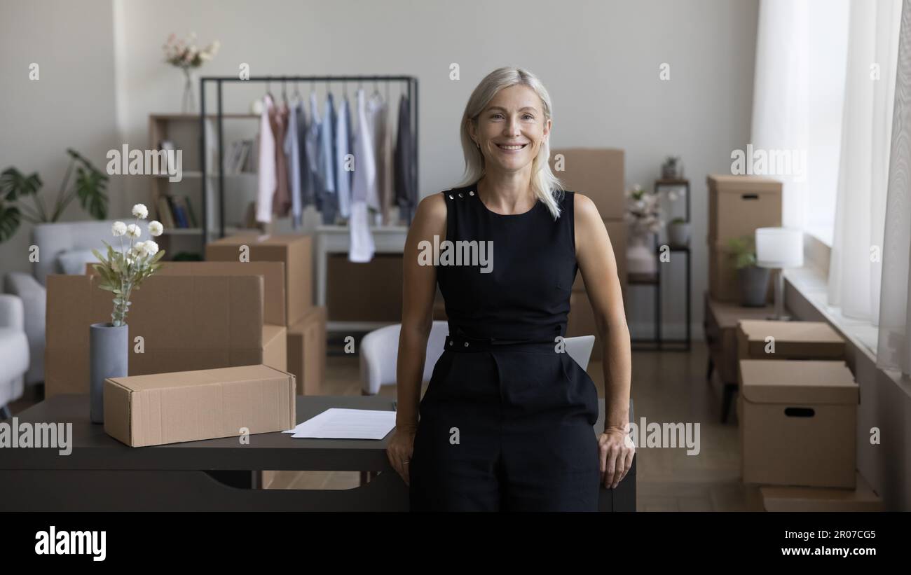 Successful happy small Internet shop owner posing at workplace Stock ...