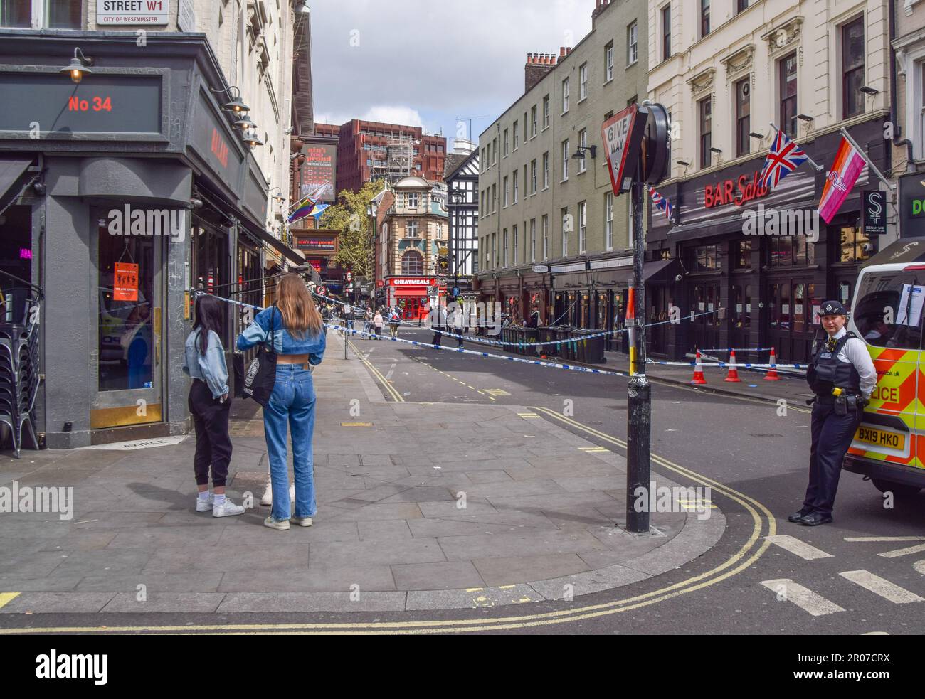 London, UK. 7th May 2023. Police seal off parts of Old Compton Street ...