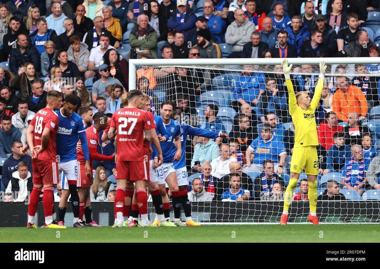 Rangers goalkeeper Robby McCrorie (right) stretches ahead of a set ...