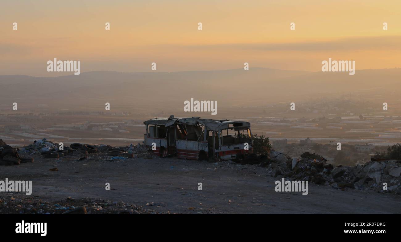 Rusty old abandoned red bus wreck in landscape of Palestine Stock Photo ...