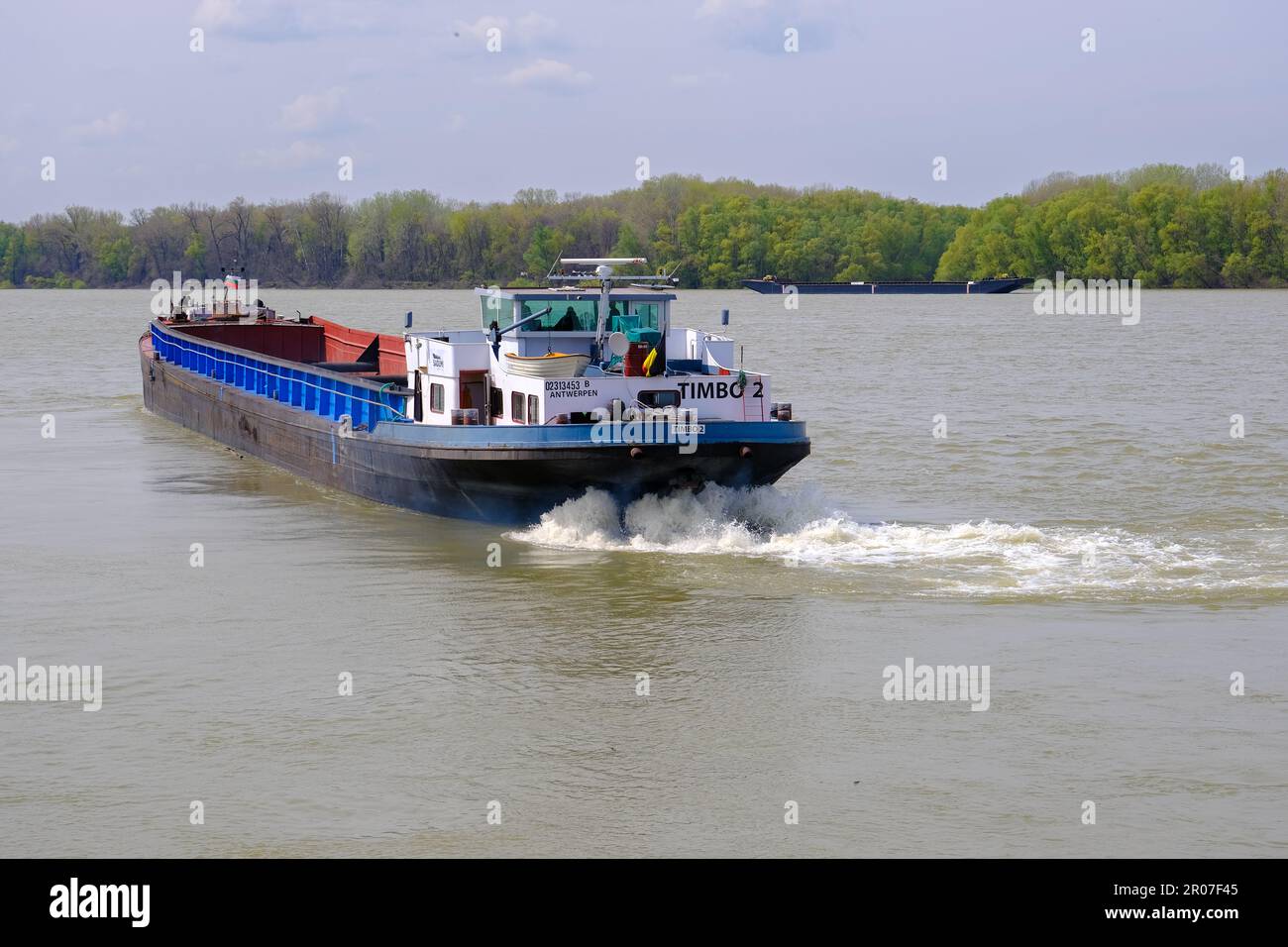 Large barge sailing under the flag of Romania on the Danube river Stock ...