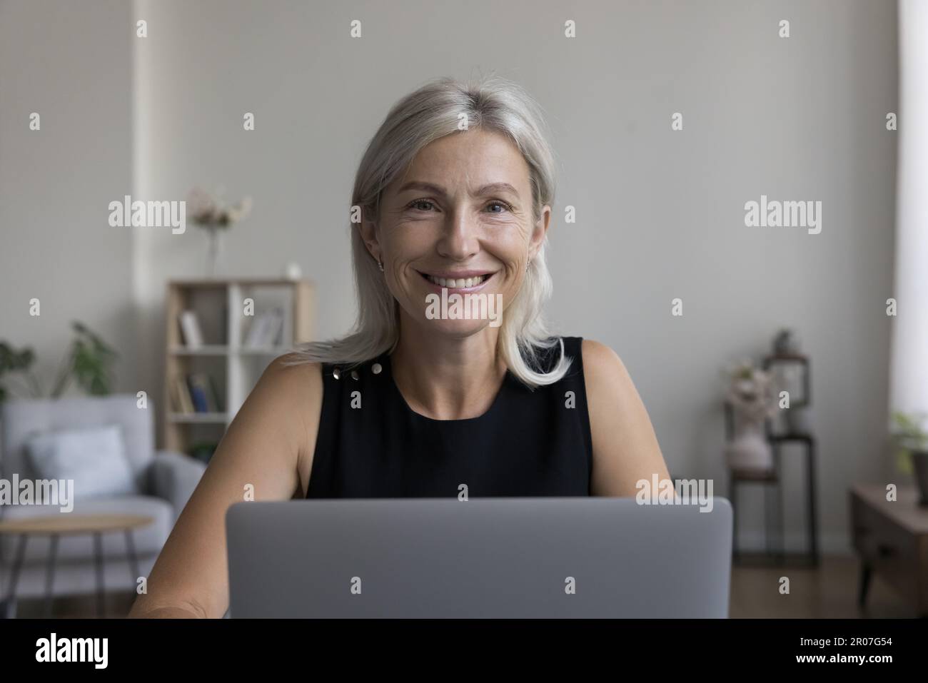 Happy pretty freelance business woman home portrait Stock Photo - Alamy