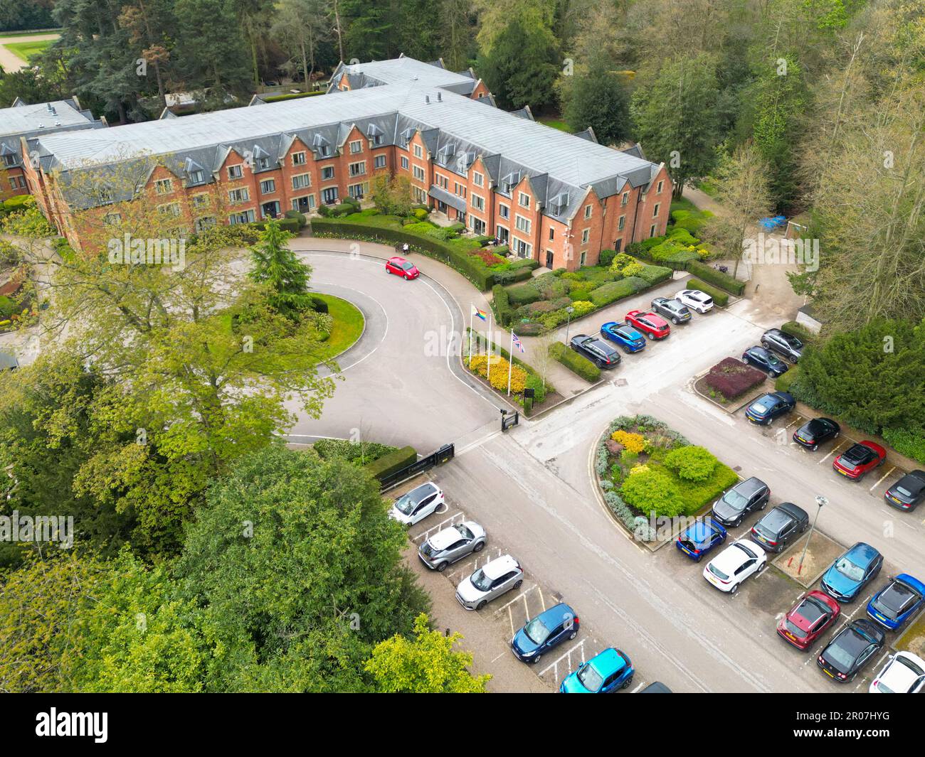 Parked hotel guests cars seen located next to a premier hotel. The ...