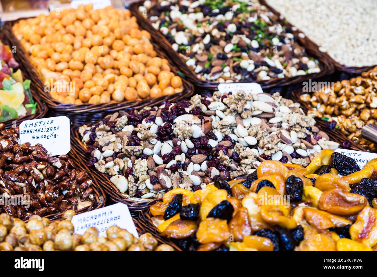 Interior of a busy food market, with detail on peanuts and almonds ...