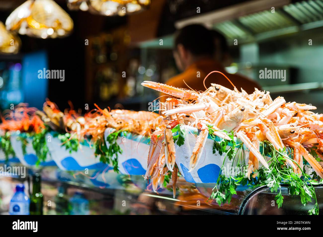 Interior of a busy fish market with detail on fresh scampi Stock Photo ...