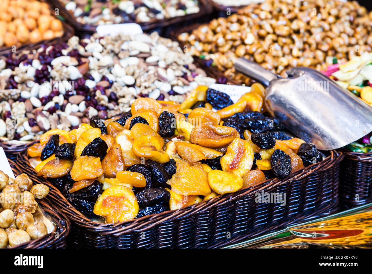 Interior of a busy food market, with detail on peanuts and almonds ...