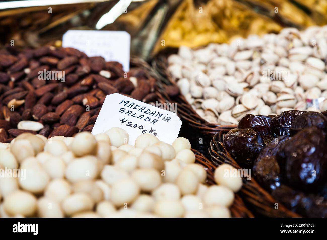 Interior of a busy food market, with detail on peanuts and almonds ...