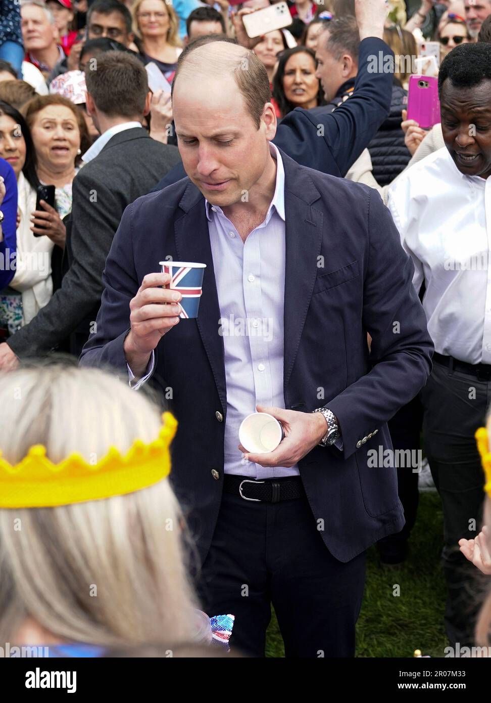 Prince William drinks a beverage, during a walkabout on the Long Walk ...