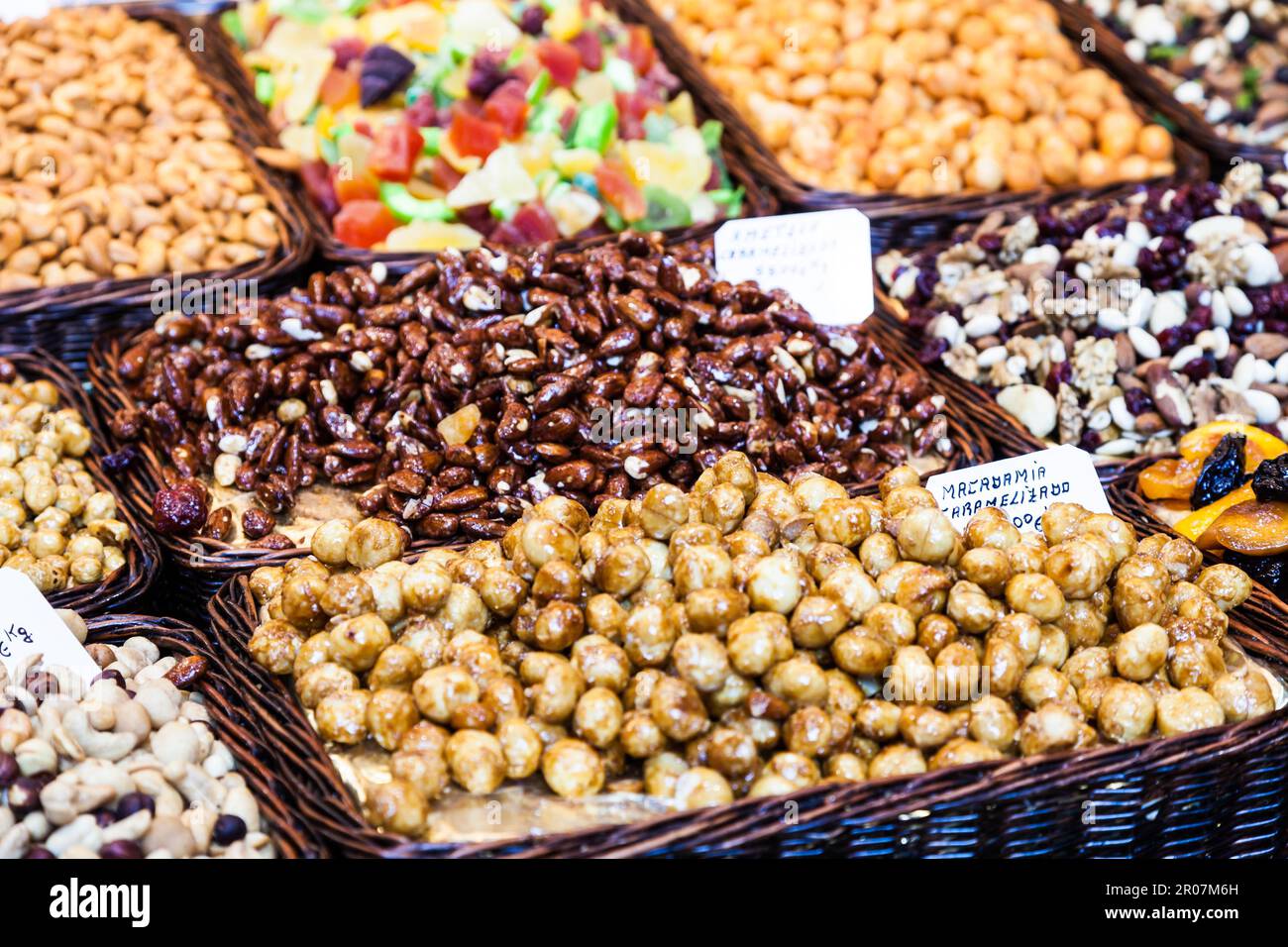Interior of a busy food market, with detail on peanuts and almonds ...