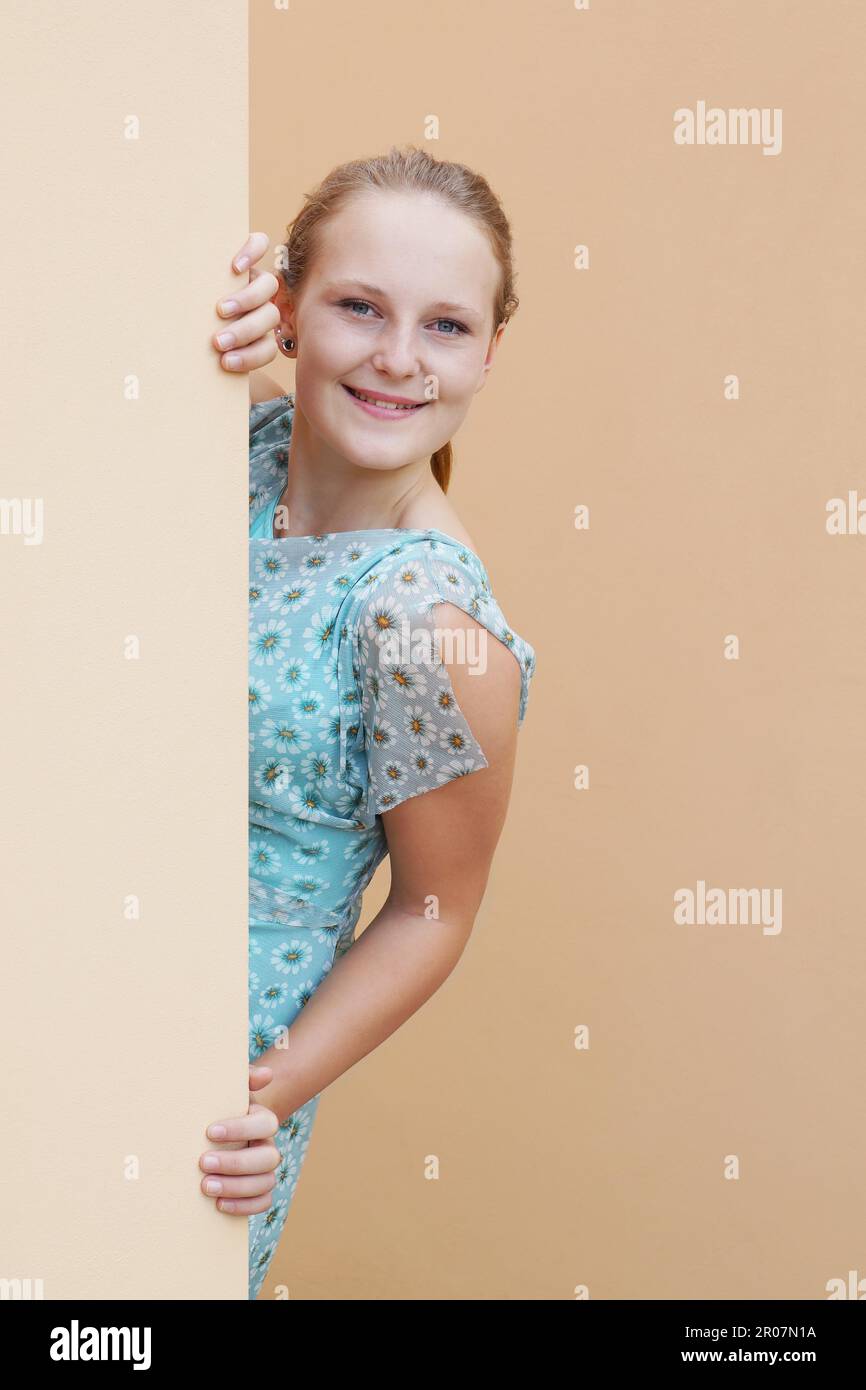 Girl Looking Around Corner