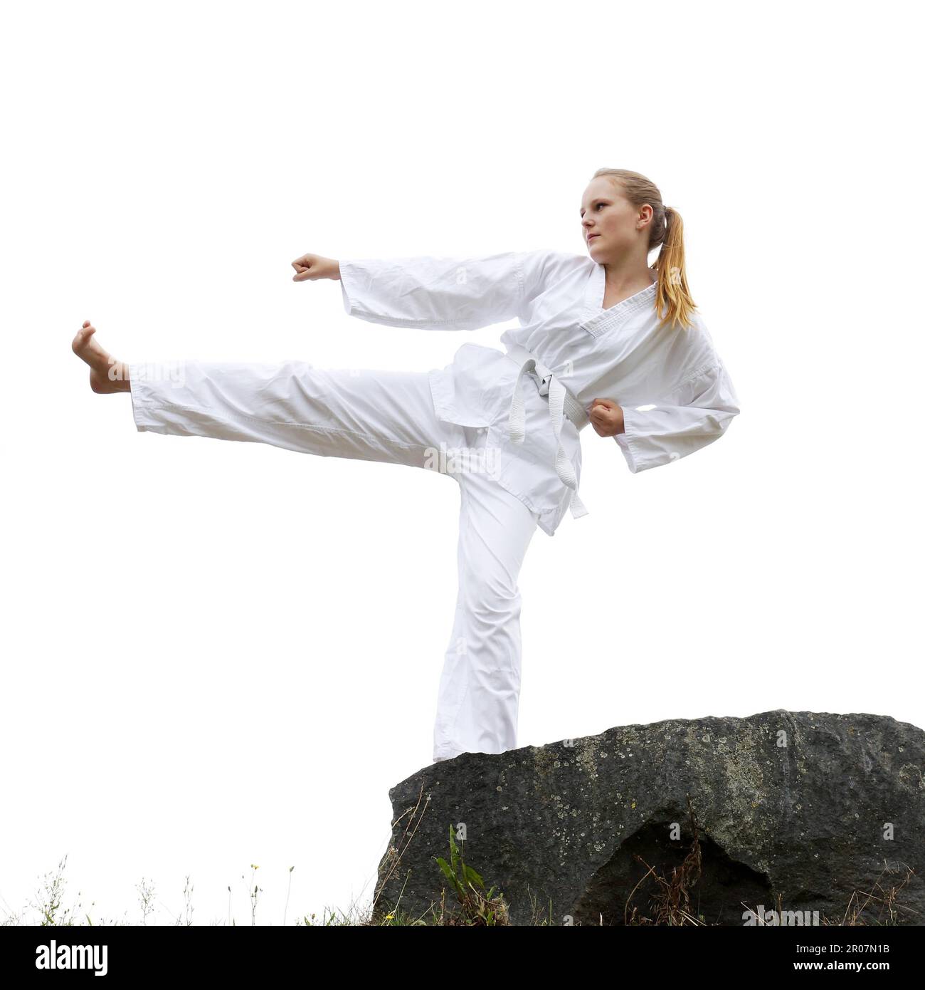 young woman practising taekwondo kick Stock Photo - Alamy