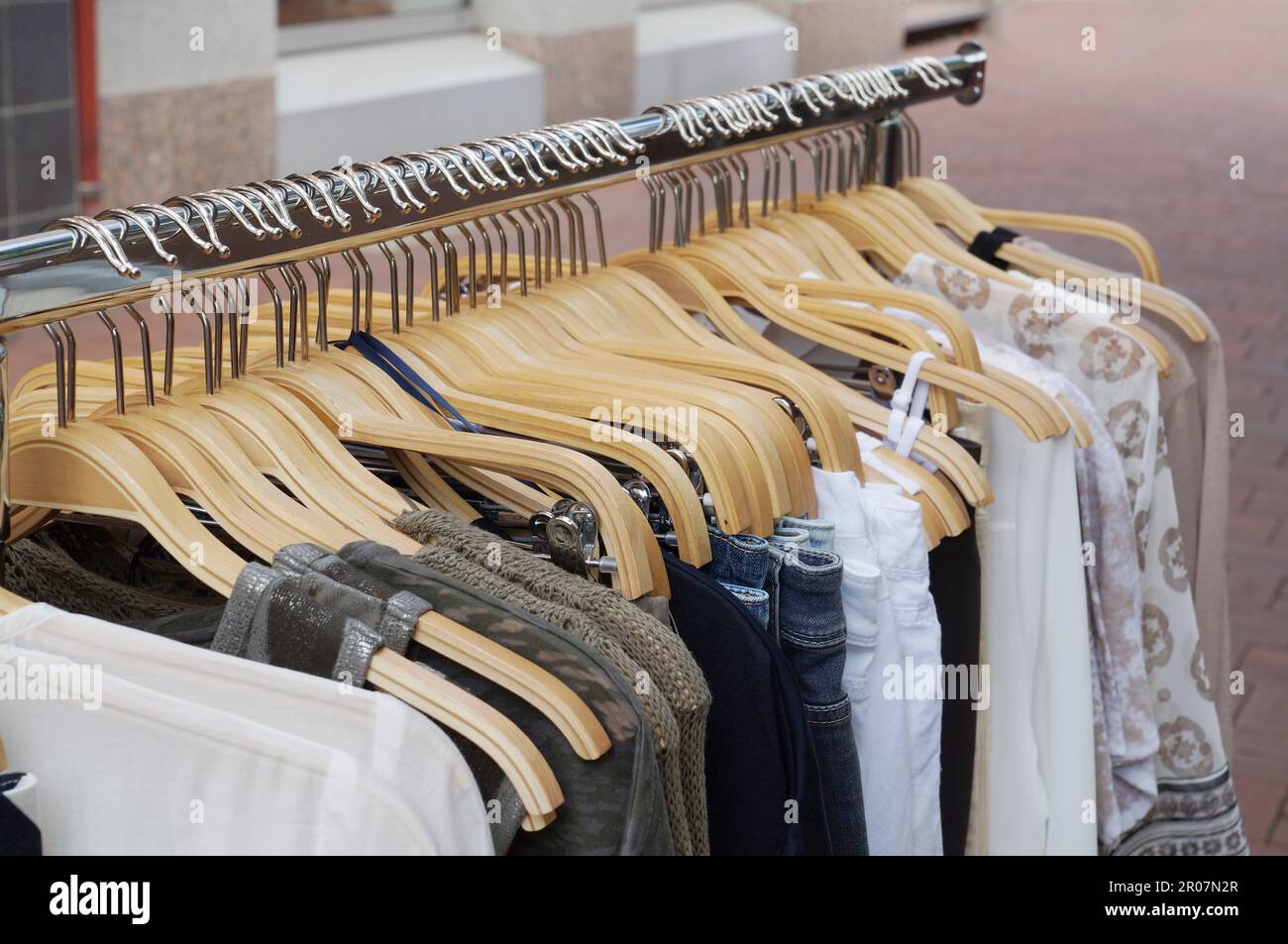 clothes rack with a selection of ladies fashion Stock Photo - Alamy