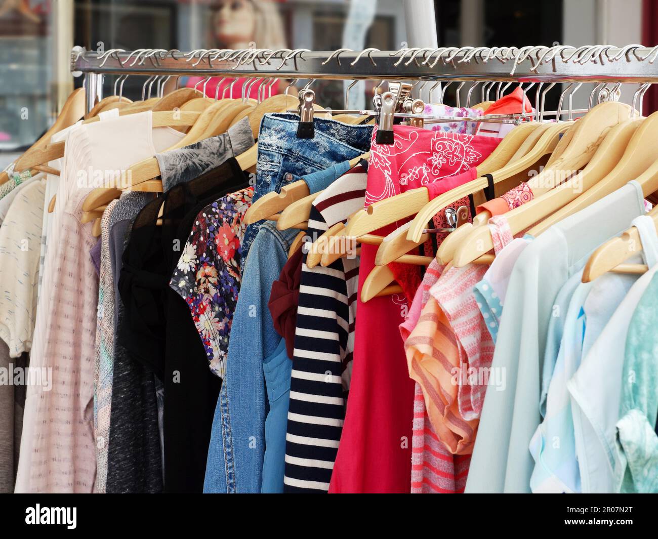 clothes rack with a selection of ladies fashion Stock Photo - Alamy
