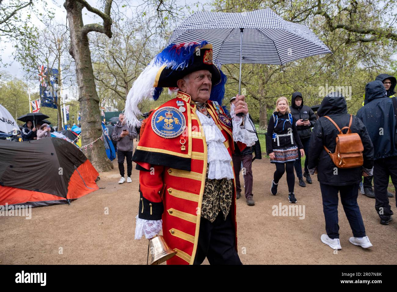 Royalist Town Crier as people shelter from torrential rain along The ...