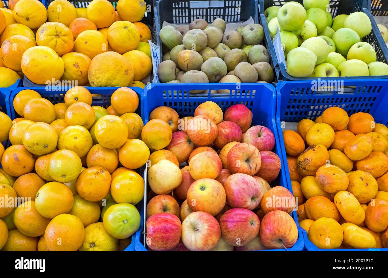 Fruits in blue boxes at a market Stock Photo - Alamy
