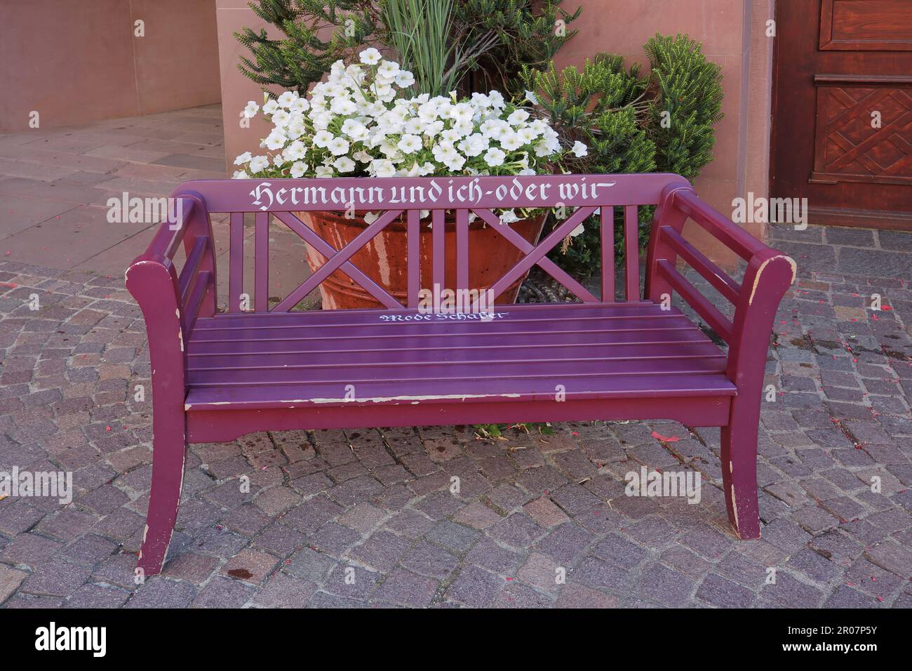 Red bench with inscription as a memorial to writer Hermann Hesse in ...
