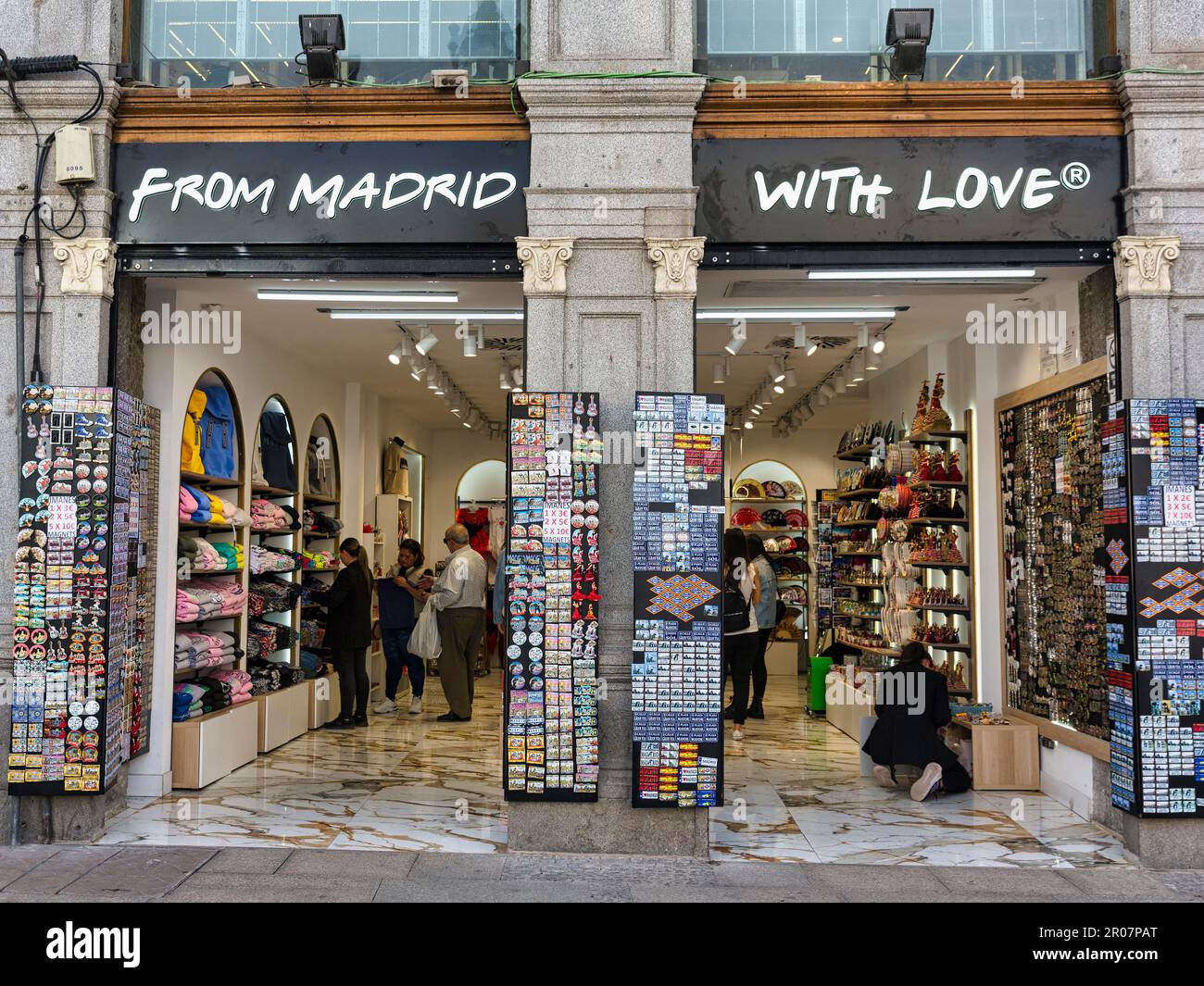 Souvenir shop with tourists in the city centre, Plaza Puerta del Sol ...