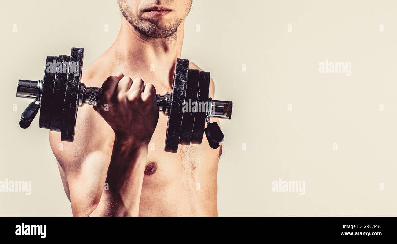 Guy hold dumbbells up in hands. Weak man lift a weight, dumbbells ...