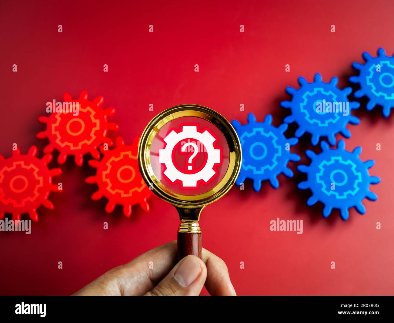 Digital gear icon wheel with question mark symbols on magnifying glass ...