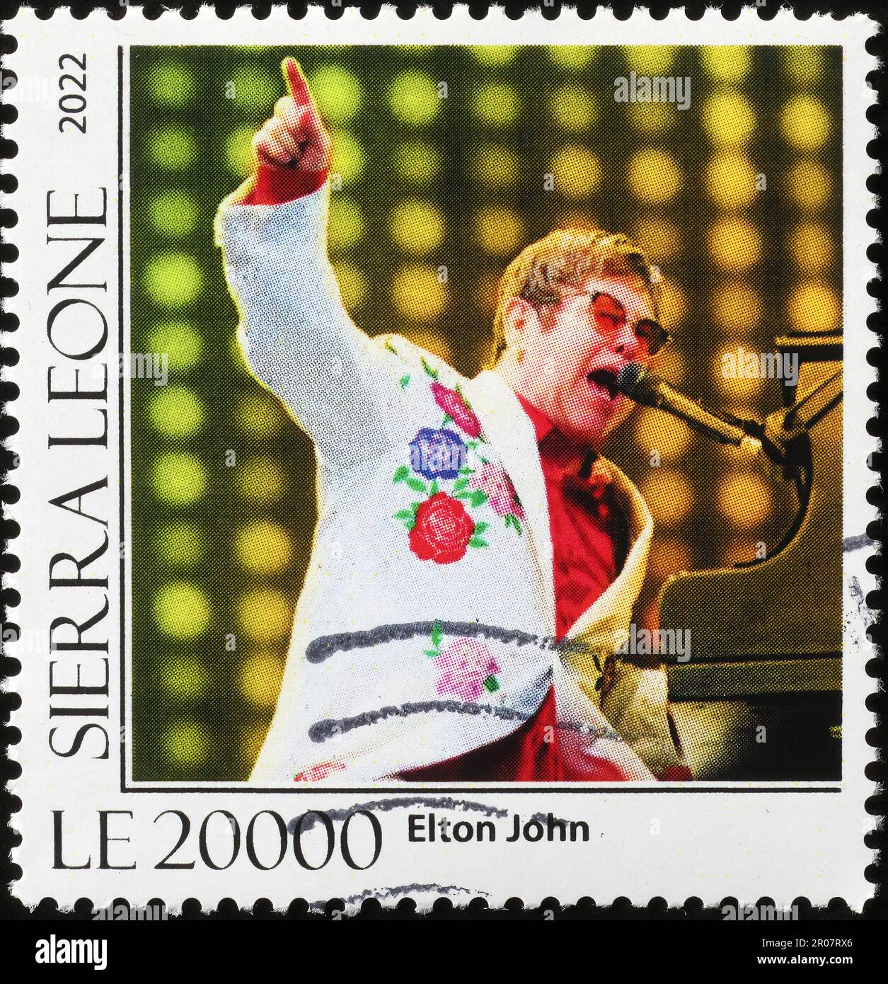 Elton John in concert on postage stamp Stock Photo - Alamy