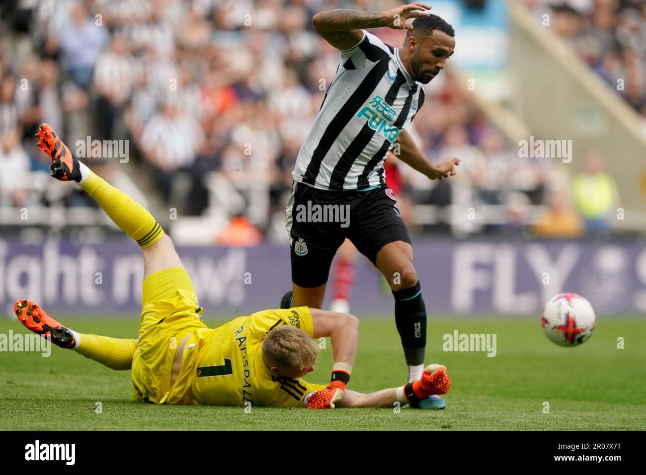 Arsenal’s Aaron Ramsdale (left) challenges Newcastle United’s Callum ...