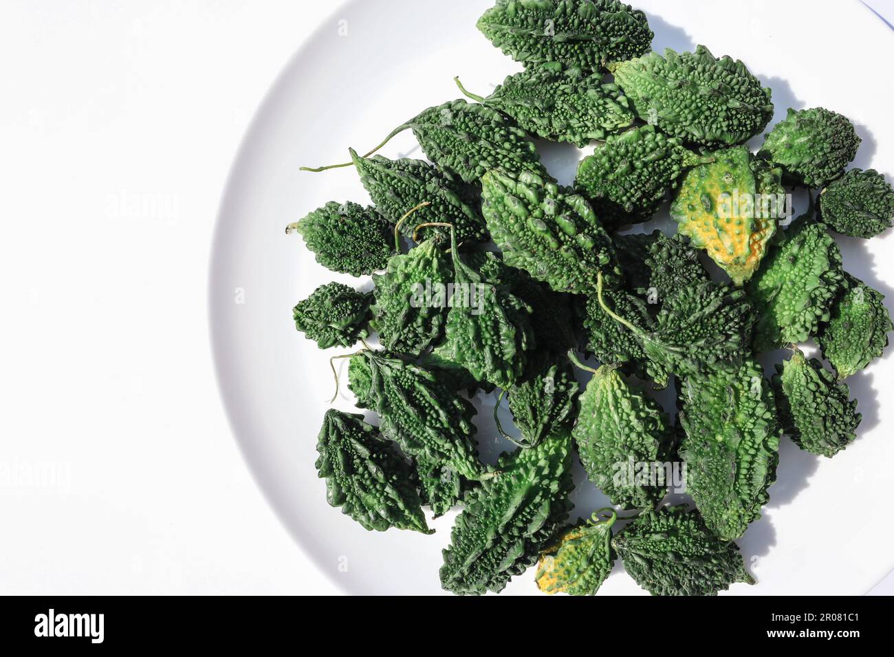 Small size Bitter gourds or Bitter Melon on white background Stock ...