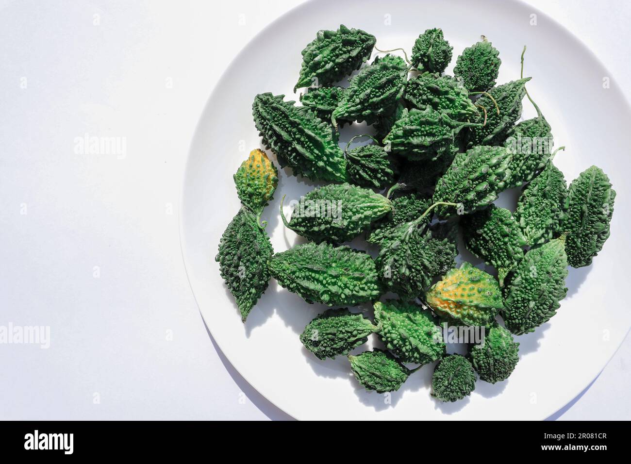 Small size Bitter gourds or Bitter Melon on white background Stock ...