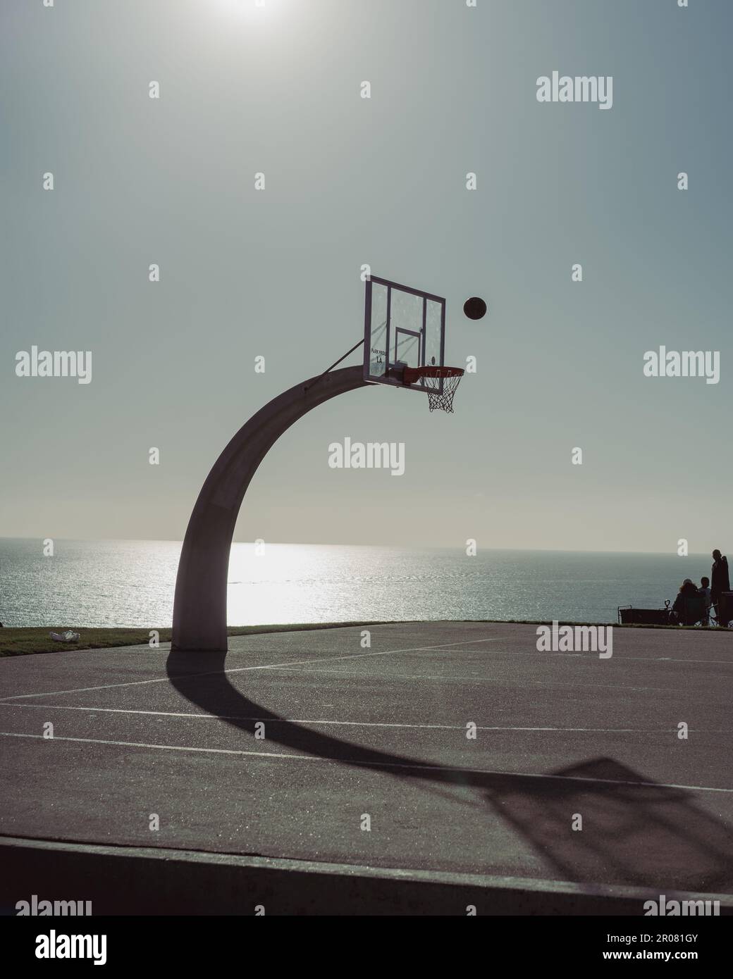 a basketball court at the edge of a cliff near the pacific ocean Stock ...