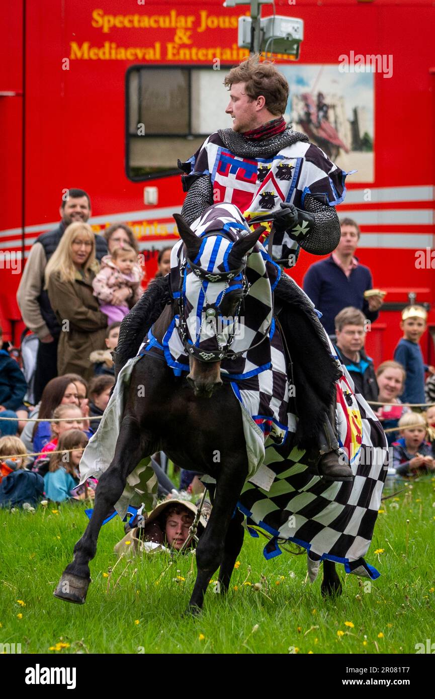 Chalfont, UK. 7 May 2023. A re enactor as an armoured knight punishes ...