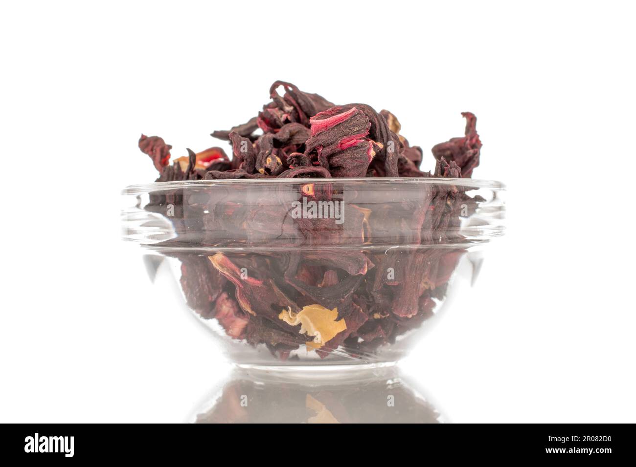Karkade tea in glass bowl, macro, isolated on white background Stock ...
