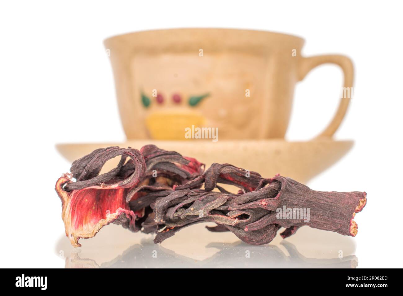 Fragrant karkade tea with ceramic cup, macro, isolated on white ...