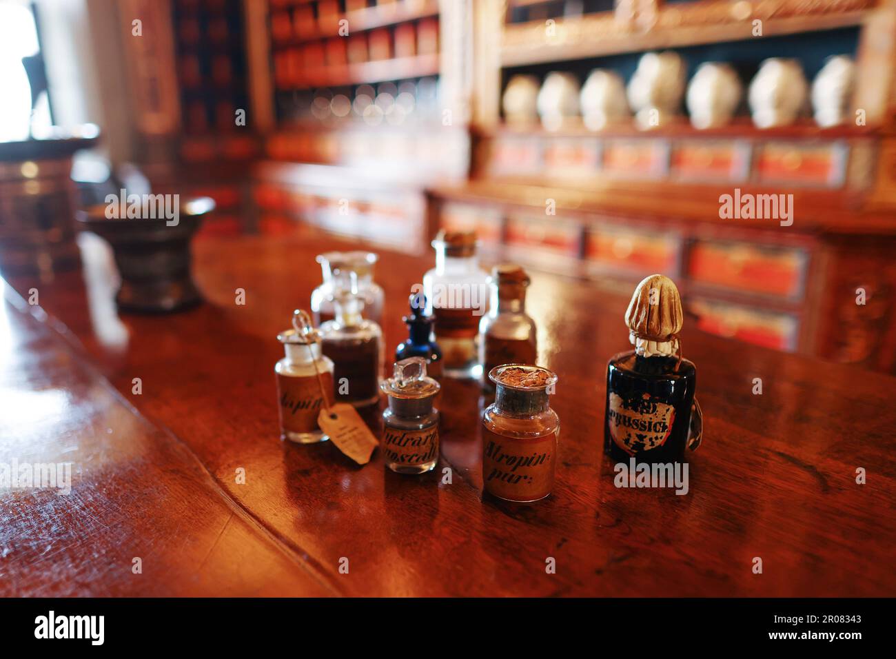 Ancient pharmacy, jars with old medicines, transparent brown glass with ...