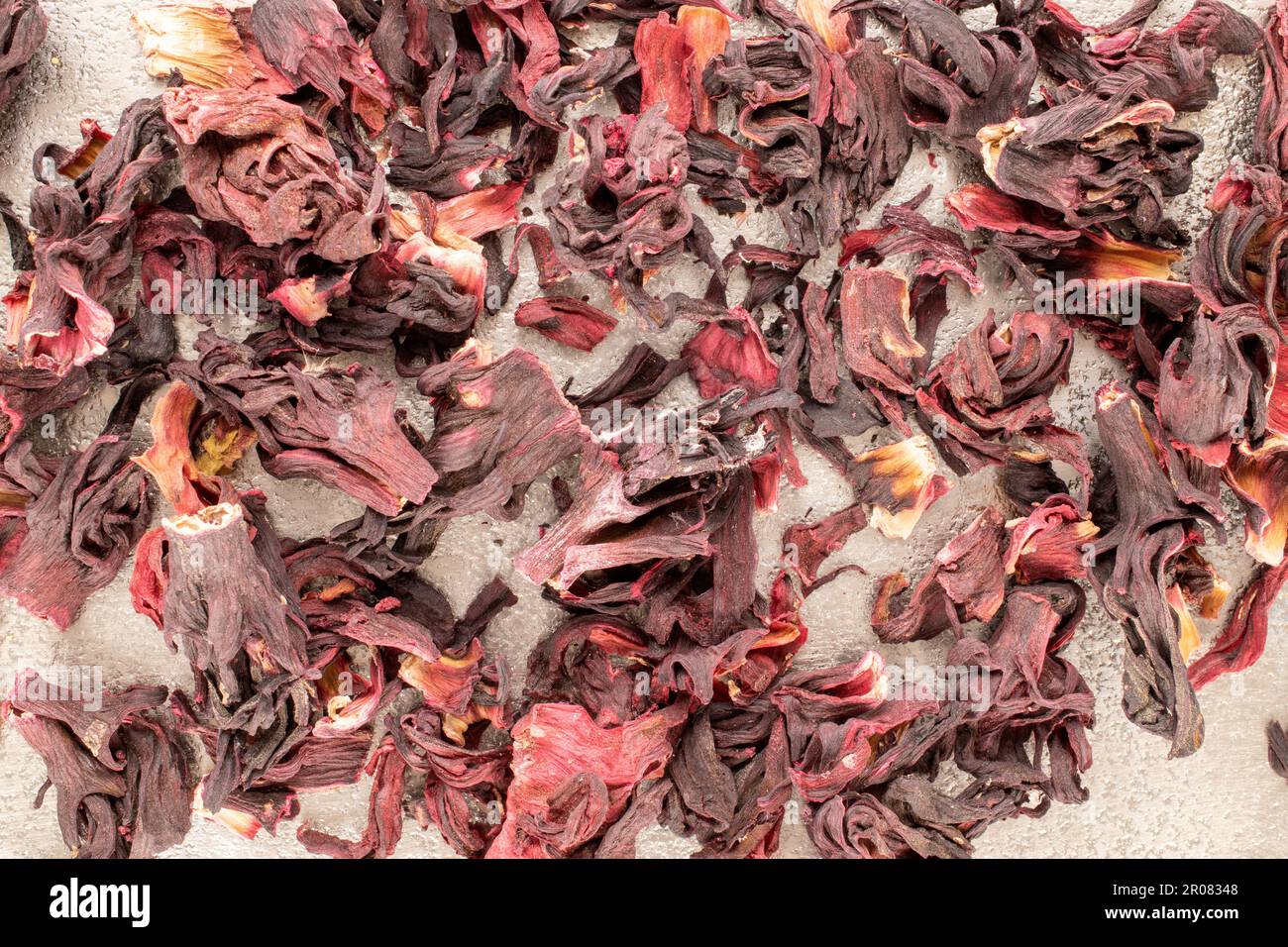 Dry aromatic karkade tea on a metal tray, macro, top view Stock Photo ...